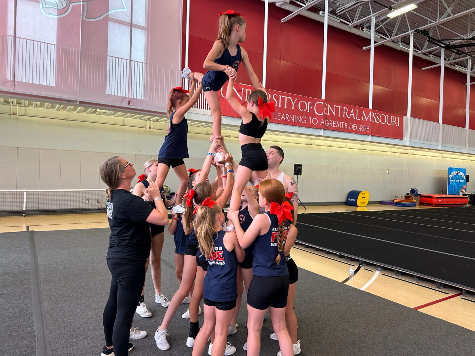 How to Become a Better Base in Cheerleading - Twister Sports